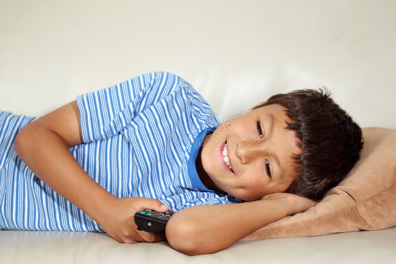 Young boy watching TV stock image. Image of living, learning - 32954055