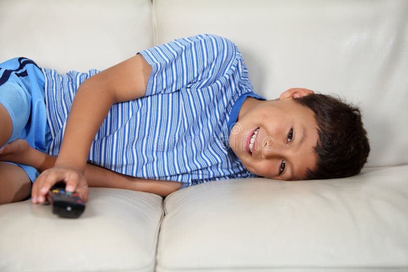 Young boy watching TV stock image. Image of handsome - 32954225