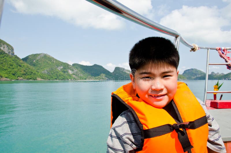Young Boy Wearing a Life Jacket Stock Image - Image of boat, beach ...