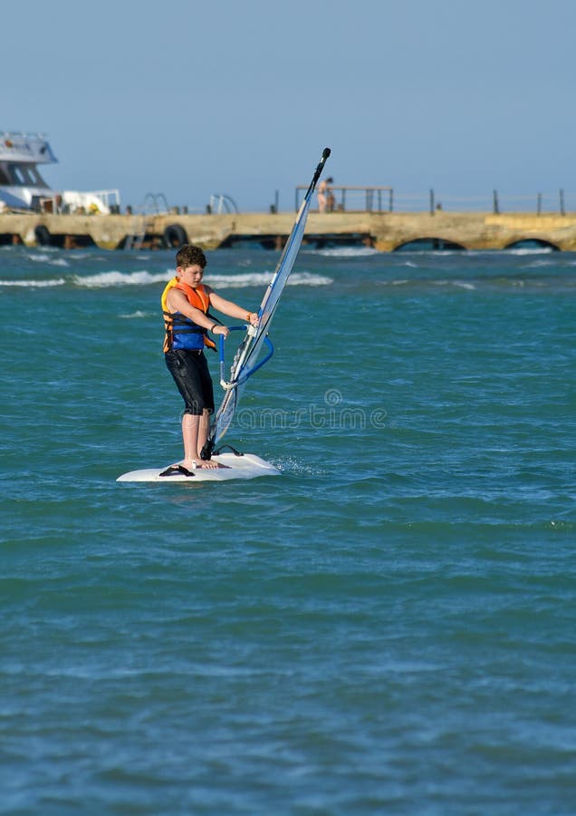 Young Boy Windsurfing and Having Fun Stock Image - Image of game, beach ...