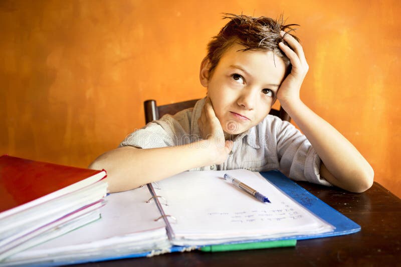 A Young Boy Worried on Homework Stock Photo - Image of caucasian, boys ...