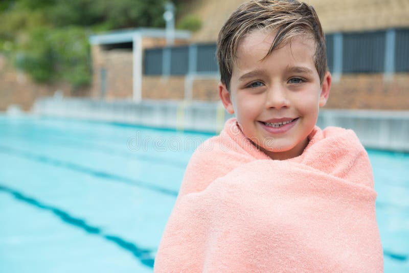 Young Boy Wrapped in Towel Standing at Poolside Stock Image - Image of ...