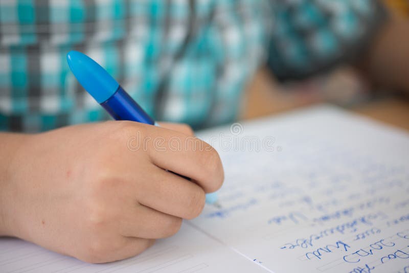 Young boy writing stock image. Image of education, concentration - 24988227