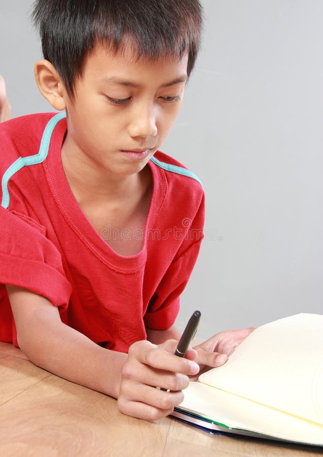 Young Boy Writing on the Floor Stock Photo - Image of childhood ...