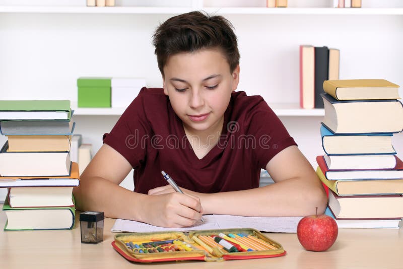 Young Boy Writing His Homework at School Stock Photo - Image of ...