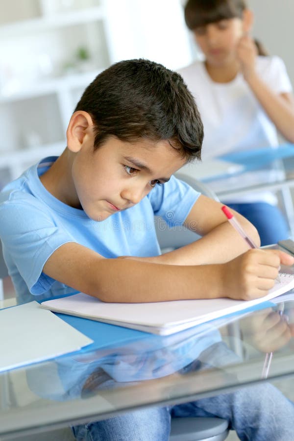 Little Boy Writing in Notebook Stock Photo - Image of learning, hair ...