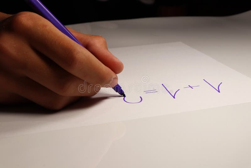 A Young Boy Writing Particular Number on Paper. he Calcute Some ...