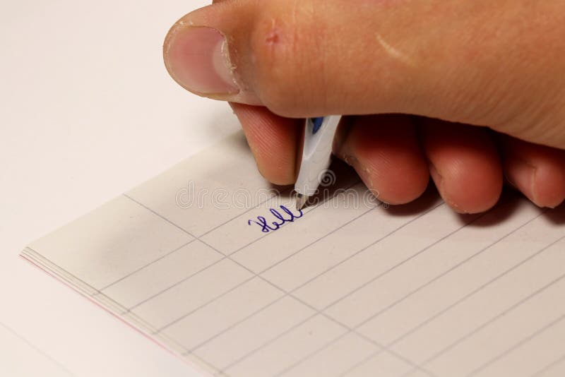A Young Boy Writing Particular Word on Paper at Dictation in School ...