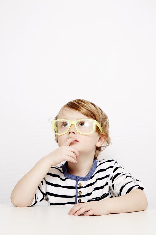 Young boy in yellow specs stock photo. Image of front - 52504984