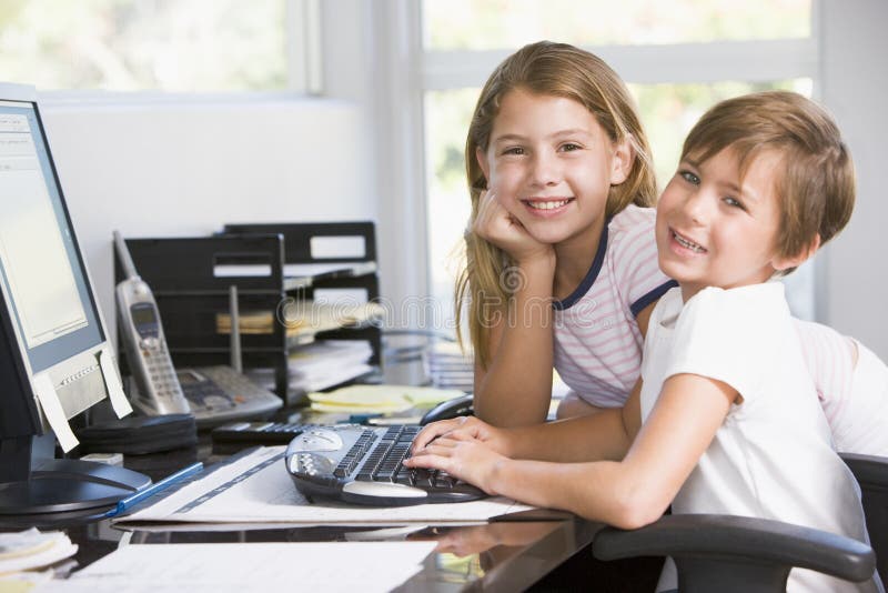 Young Boy and Young Girl in Office with Computer Stock Image - Image of ...