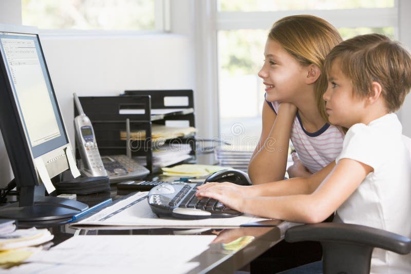 Young Boy and Young Girl in Office with Computer Stock Image - Image of ...