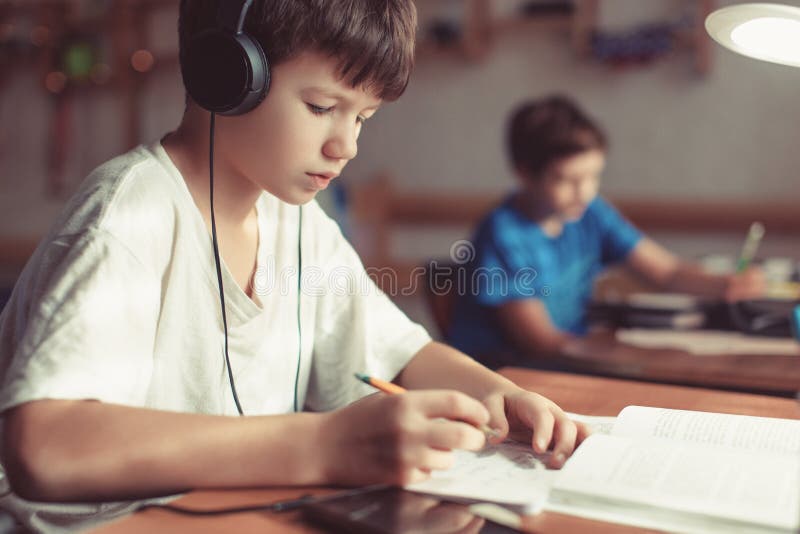 Young Boys Doing Homework at Desk Stock Photo - Image of schoolboys ...