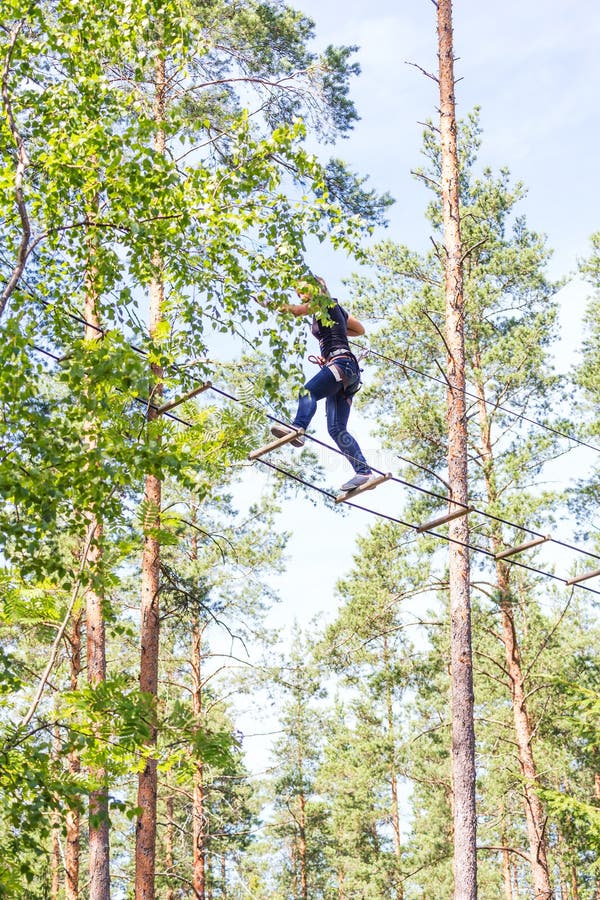 Young Brave Woman Climbing in Adventure Rope Park Stock Image - Image ...