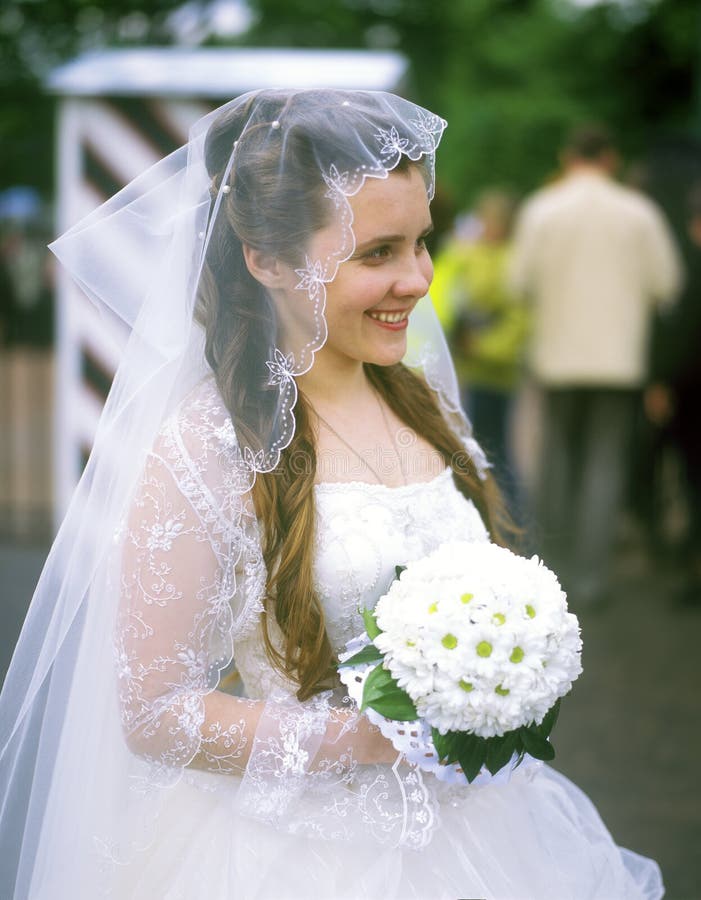 Young bride with a bouquet stock photo. Image of wedding - 9822316