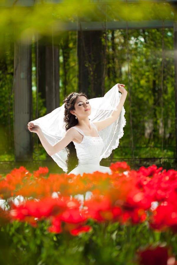 Young Bride with Flowers Outdoors Stock Image - Image of love, marriage ...