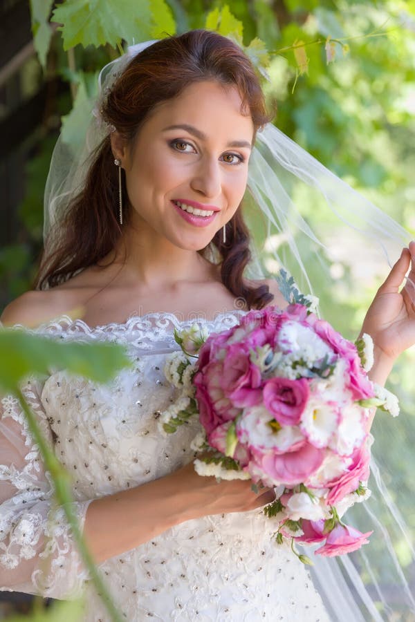 Young bride in garden stock photo. Image of traditional - 83351658