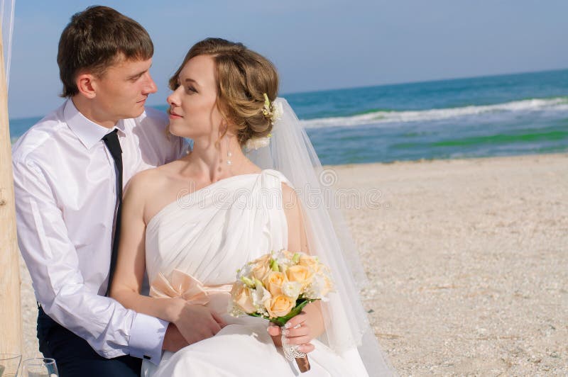 Young Bride and Groom on the Beach Stock Photo - Image of love, married ...