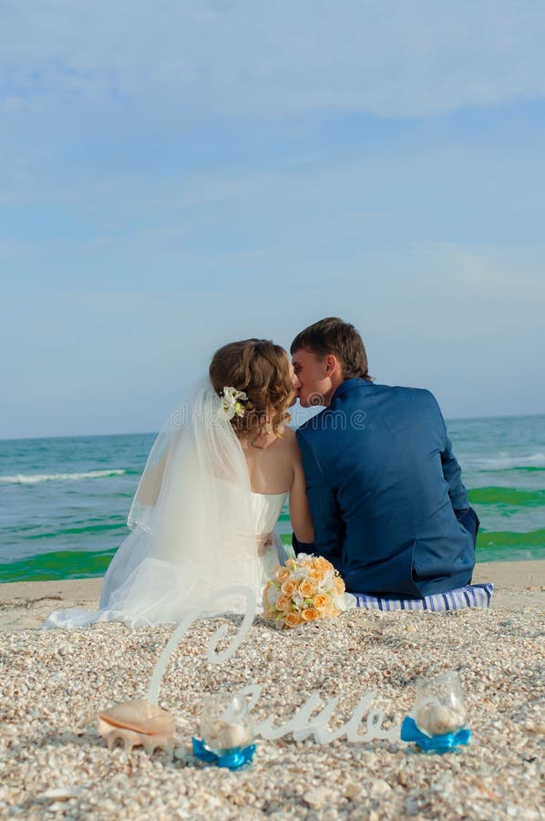 Young Bride and Groom on the Beach Stock Image - Image of copy ...