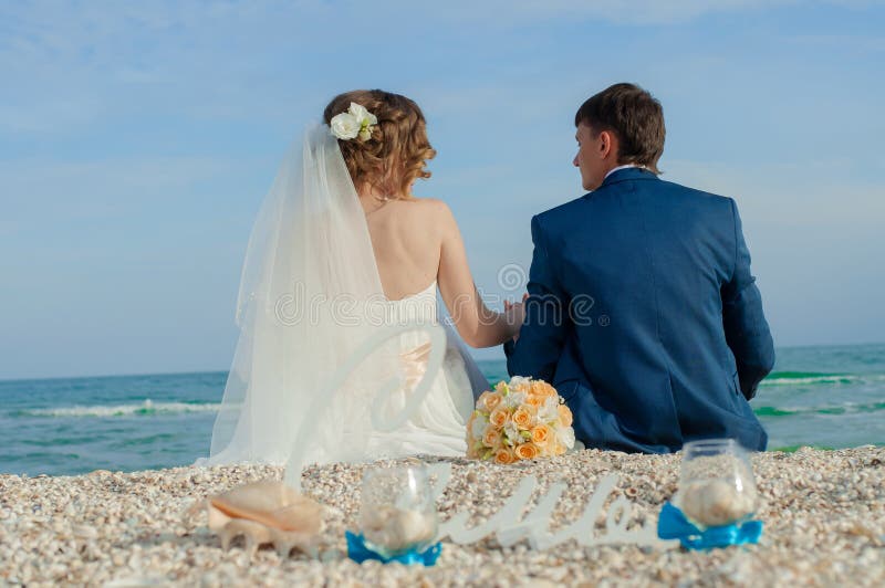Young Bride and Groom on the Beach Stock Image - Image of groom ...