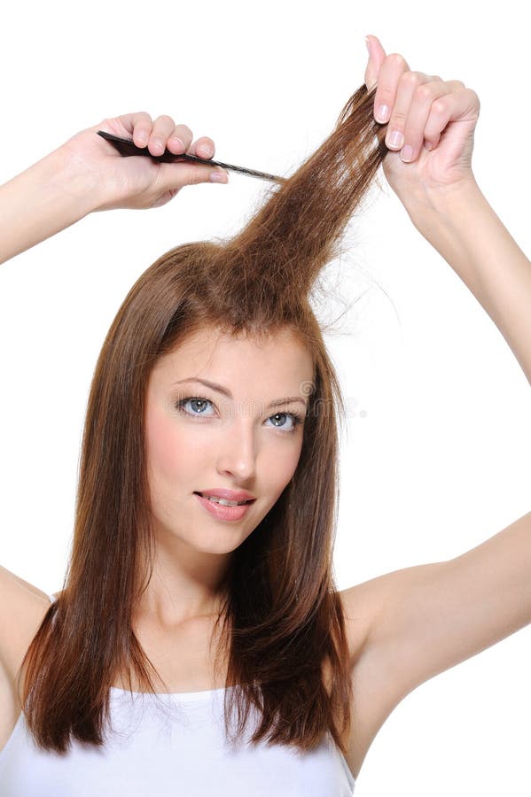 Young Brunette Girl Doing Backcombing with Comb Stock Image - Image of ...