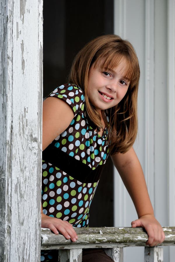 Young Brunette Girl Leaning on Railing Stock Photo - Image of brunette ...