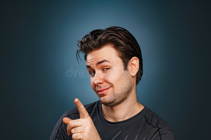 Young Man Pointing with Finger Stock Image - Image of emotion, face ...