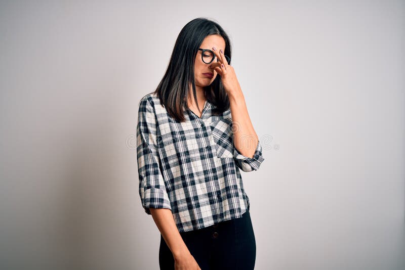 Young Brunette Woman With Blue Eyes Wearing Casual Shirt And Glasses