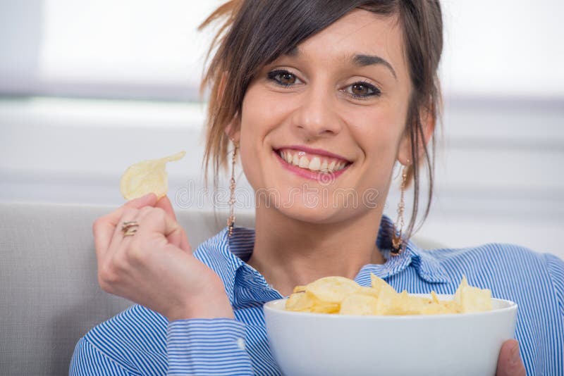 Young Brunette Woman Eating Chips Stock Image - Image of chips ...