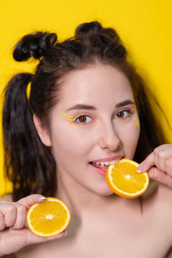 Young Brunette Woman Girl With Slice Of Orange Fruit Near Skin Face On