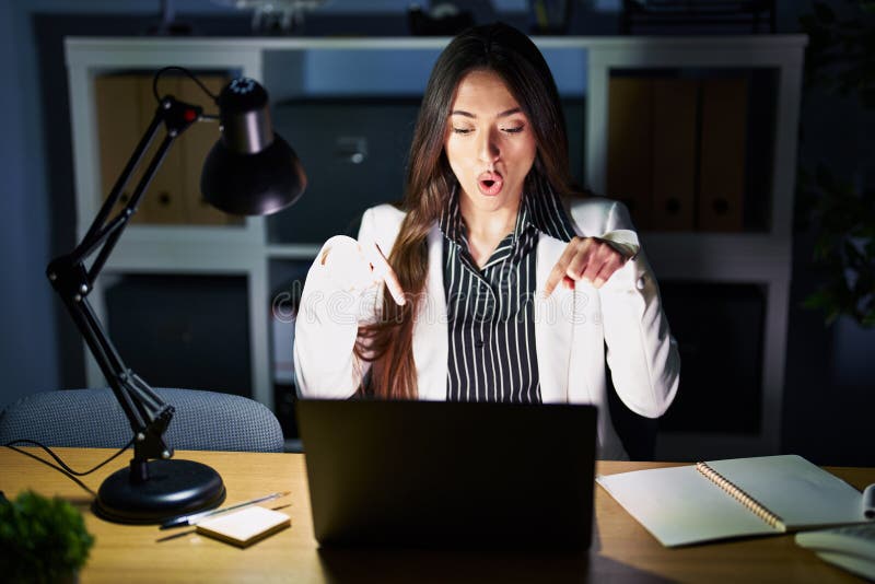 Young Brunette Woman Working At The Office At Night With Laptop
