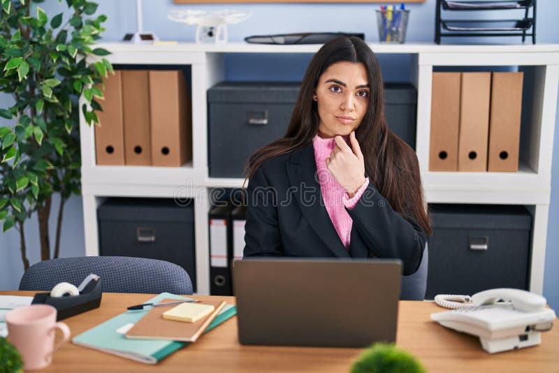 Young Brunette Woman Working at the Office Serious Face Thinking about ...
