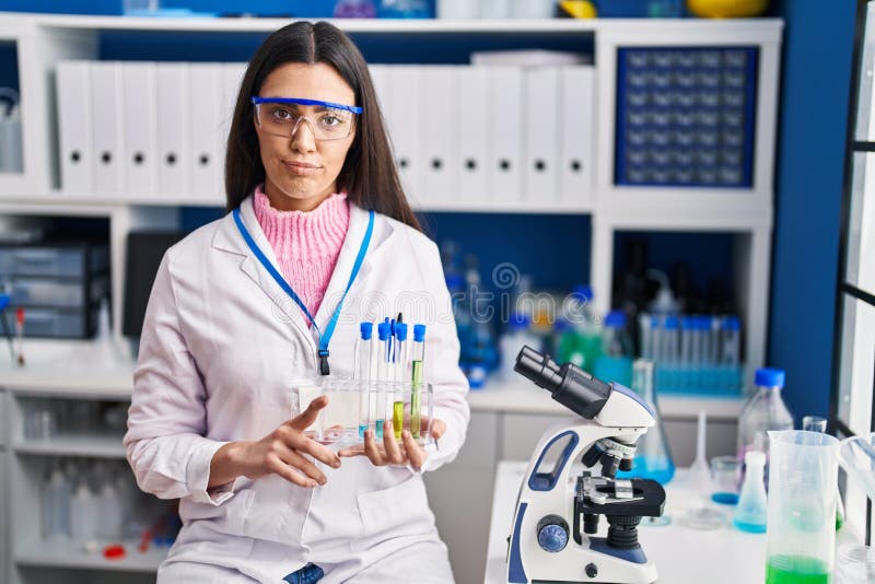 Young Brunette Woman Working at Scientist Laboratory Thinking Attitude ...