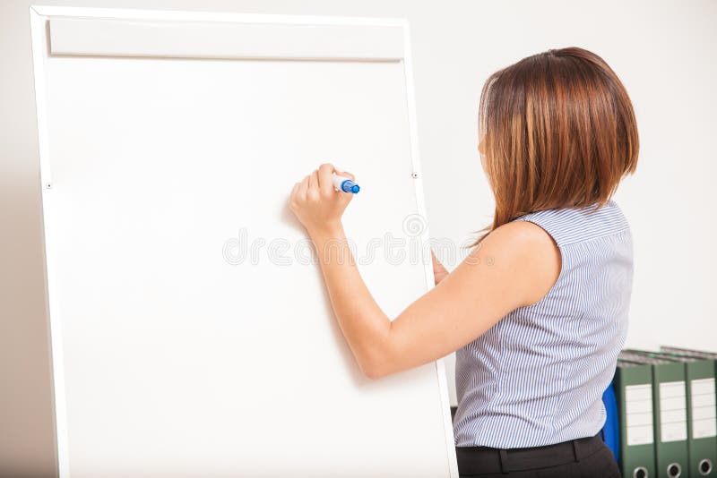 Young Brunette Writing on a Flip Board Stock Photo - Image of copy ...