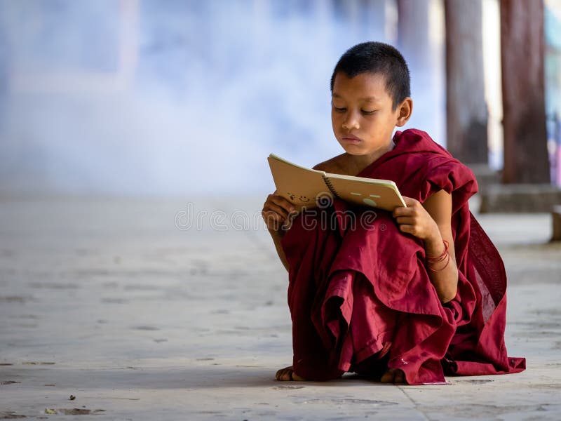 Young Buddhist Monk Reading in Temple Editorial Photography - Image of ...