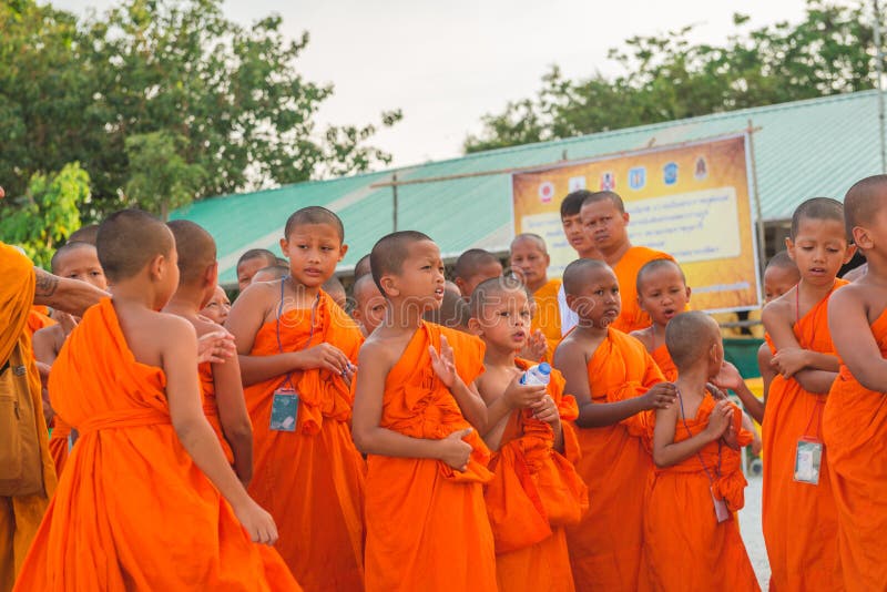 Young Buddhists in Orange Clothes Near the Big Buddha Temple in Phuket ... Young Buddhists in Orange Clothes Near the Big Buddha Temple in Phuket ...