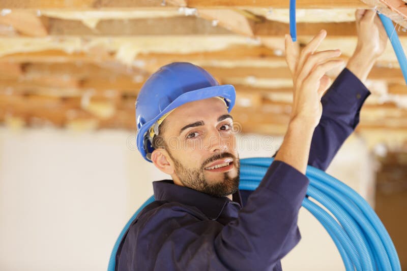 Young builder with cables stock image. Image of ventilation - 261514193