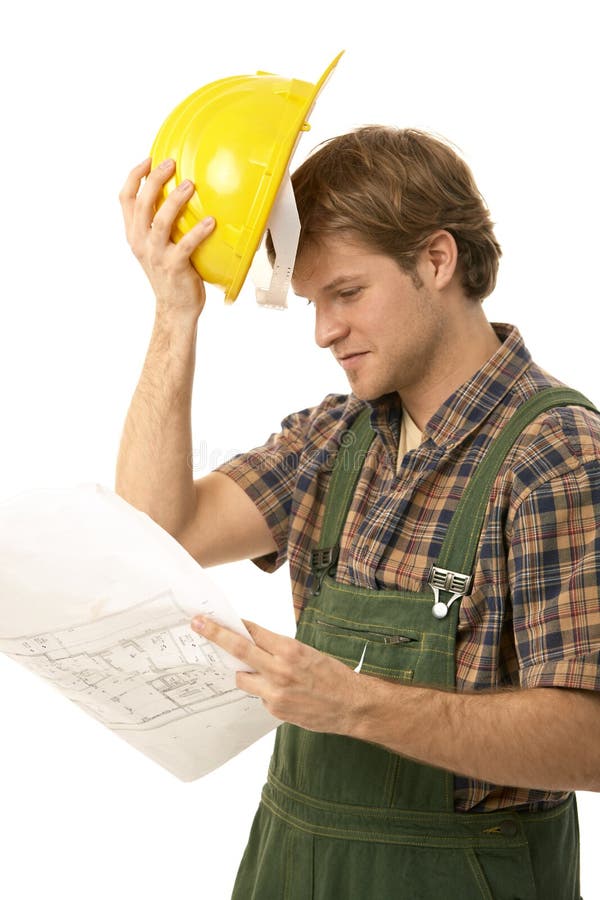 Young Builder Looking at Floor Plan Stock Image - Image of checking ...