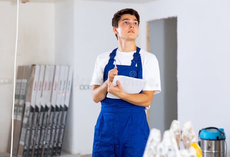 Young Builder Making Checklist while Planning Indoor Building Overhaul ...