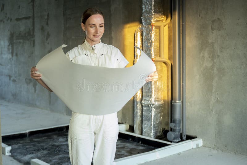 Young Building Contractor Examining Housing Project on Construction ...