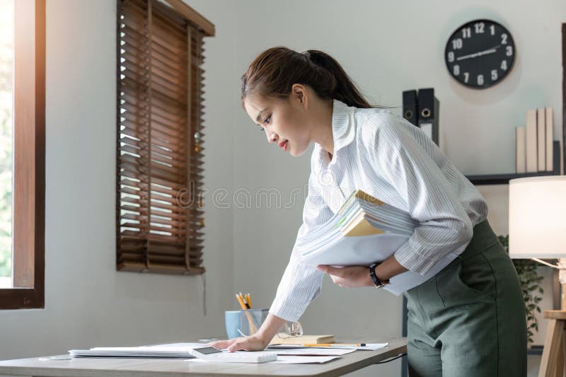 Young Business Asian Woman Holding Document File and Looking at ...