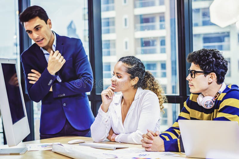 Young Business Design Team Having a Meeting Together Stock Photo ...