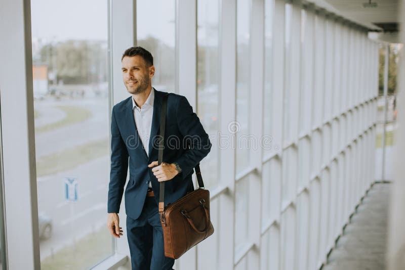 Young Business Executive with Briefcase Going Up the Stairs Stock Photo ...