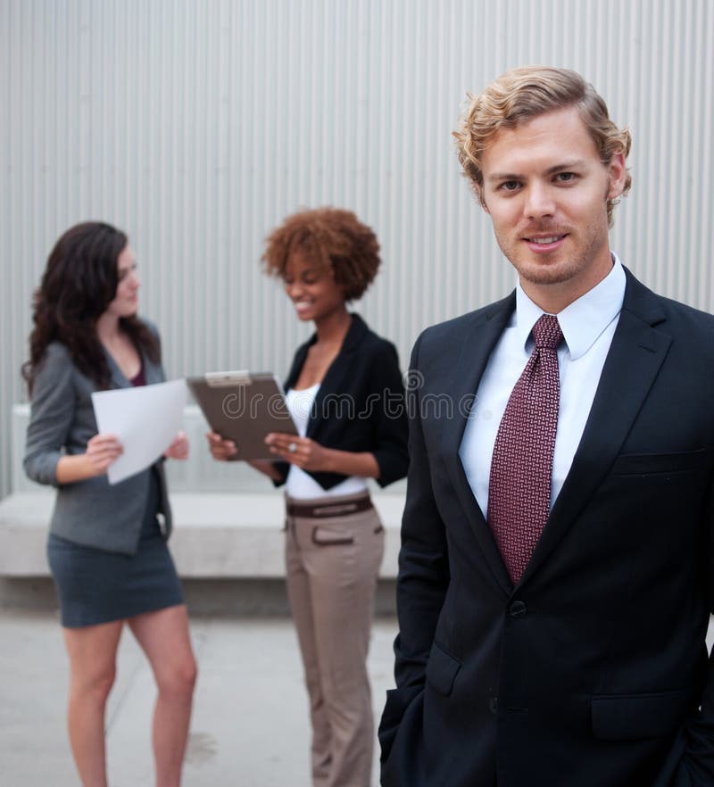 Attractive Young Business Group Standing Together at Office Stock Photo ...