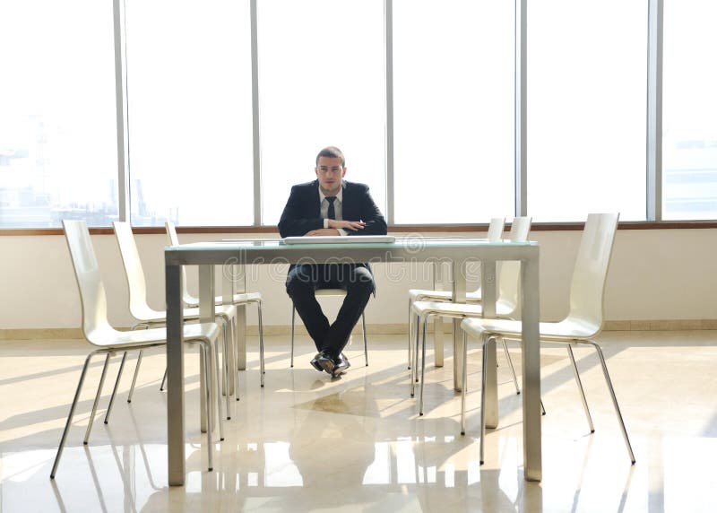 Young Business Man Alone in Conference Room Stock Photo - Image of ...