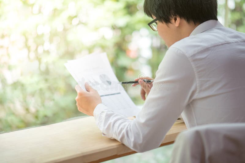 Young Business Man Checking Report Document Stock Image - Image of ...
