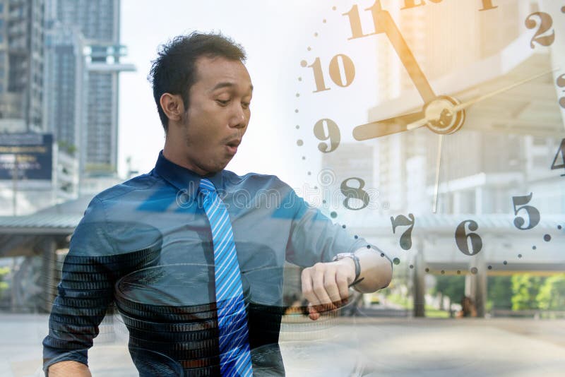 Young Business Man Checking the Time Stock Image - Image of coin ...