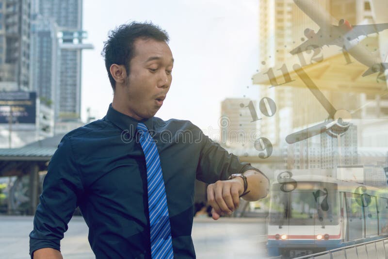 Young Business Man Checking the Time on His Watch. Time Planes T Stock ...