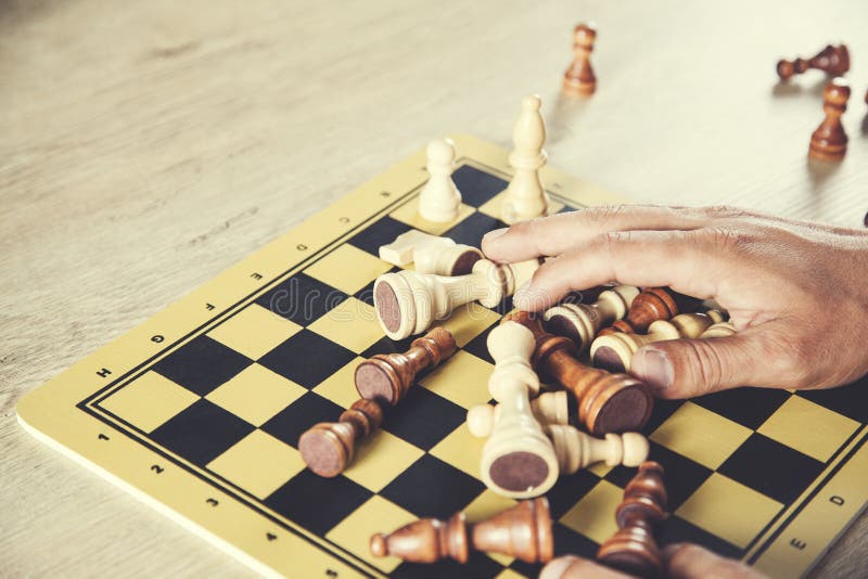 Man hand chess on board stock photo. Image of hand, decision - 152778892