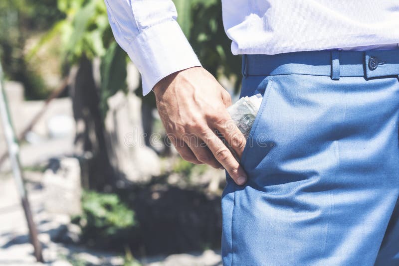 Man hand money on pocket stock image. Image of cash - 194419989