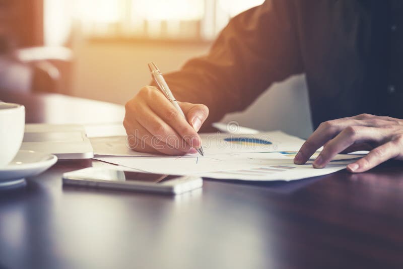 Young Business Man Hand Writing Paper In The Office With Sunlight ... Young Business Man Hand Writing Paper In The Office With Sunlight ...